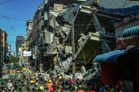 Rescuers race to reach people still trapped in collapsed Tanzania ...