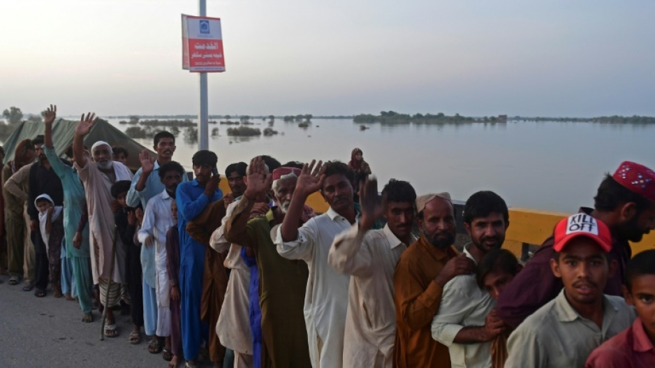 Villagers brave snakes and hunger to protect land in flooded Pakistan ...